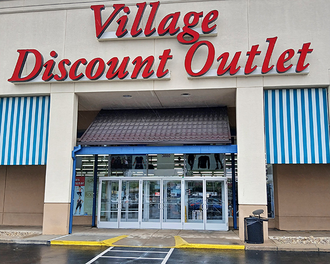 The symmetrical entrance of Village Discount Outlet stands ready to welcome bargain hunters from across the Dayton area.