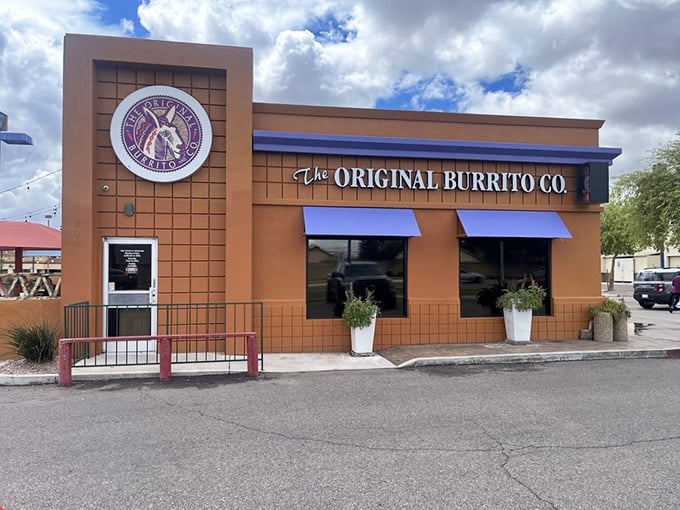 That blue and orange exterior might look modest, but inside lies burrito paradise waiting to happen.