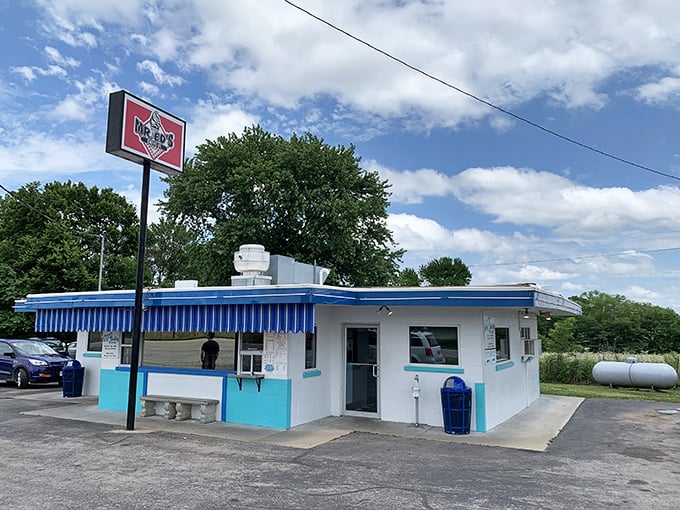 The blue-and-white time capsule that is Mr. Ed's Drive In stands proudly against the Missouri sky, beckoning hungry travelers with retro charm.