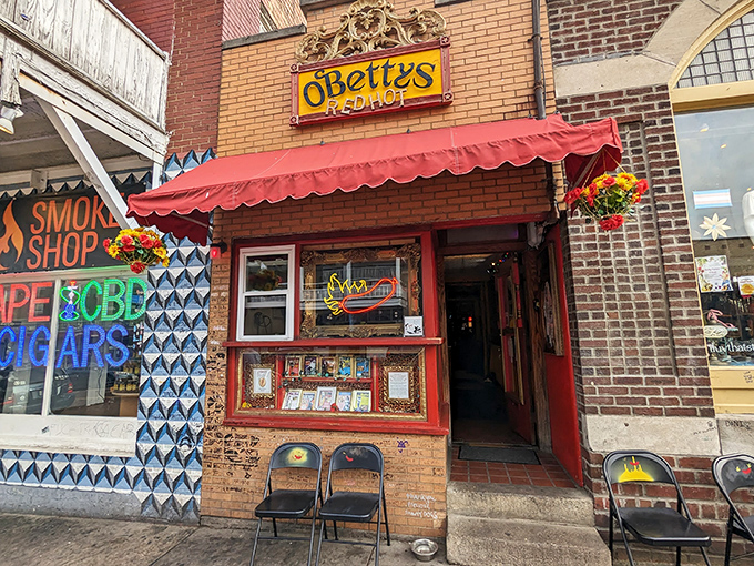 The unassuming storefront of O'Betty's Red Hot beckons with its vibrant red awning and quirky charm, like a secret clubhouse for hot dog aficionados.