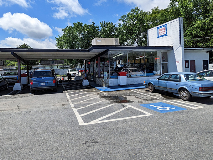 The patriotic sign beckons like a North Star for hot dog pilgrims. Kermit's iconic red, white, and blue marquee has guided hungry travelers for generations.
