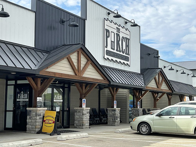 The modern rustic charm of The Porch welcomes hungry visitors with its distinctive wooden beams and inviting covered entrance.
