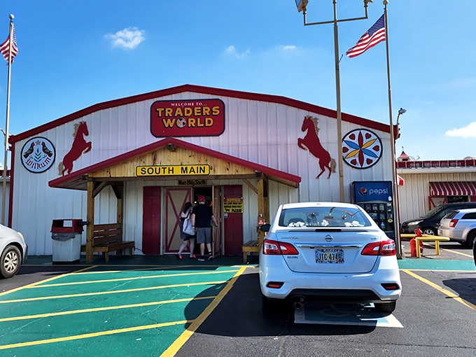 The iconic red-trimmed entrance to Traders World stands like a retail Narnia wardrobe—step through those doors and enter a wonderland of possibilities.