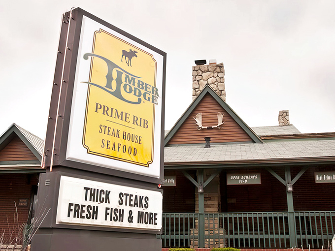 The rustic exterior of Timber Lodge promises woodland charm and serious steaks, with those "Super Size Cocktails" signs practically begging you to come inside.