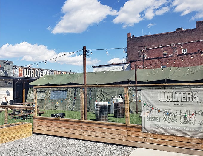 The unassuming exterior of Walter's Southern Kitchen promises no frills, just thrills for your taste buds. String lights and green awnings set the stage for BBQ magic.