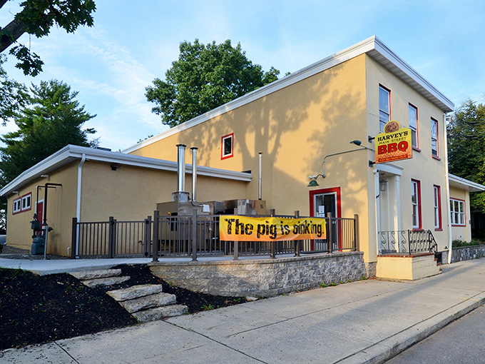 The bright yellow exterior of Harvey's Main Street BBQ announces itself with a banner that doesn't mince words: "The pig is cooking." Consider yourself warned&mdash;and enticed.