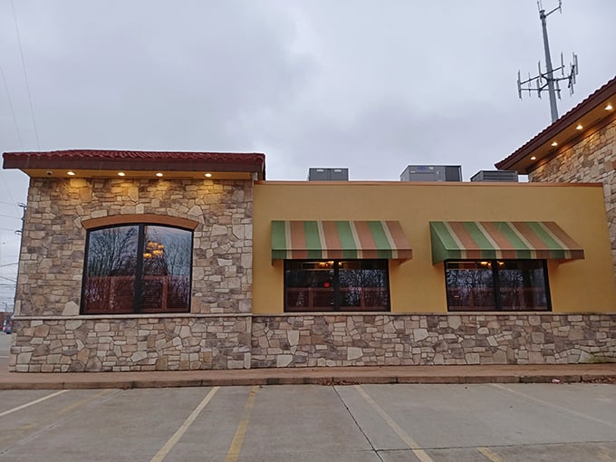 The stone and stucco exterior of Stancato's stands like a culinary fortress, its red-tiled roof and striped awnings promising Italian treasures within.