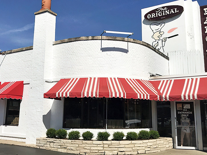 The iconic white building with red-and-white striped awnings stands like a beacon of breakfast hope on Wilmette's Green Bay Road.
