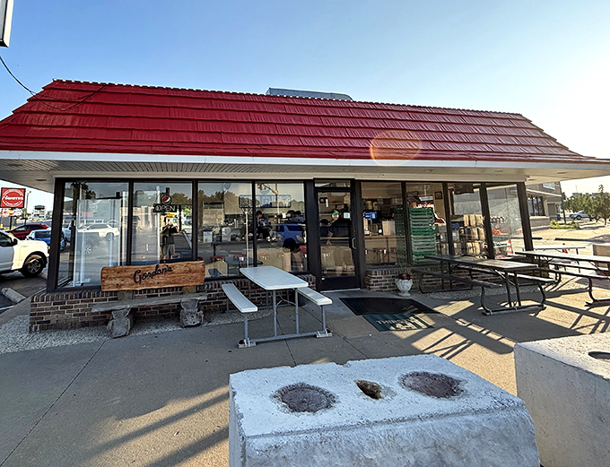 The classic red-roofed drive-in beckons like a time machine to simpler days when great burgers didn't need fancy packaging.