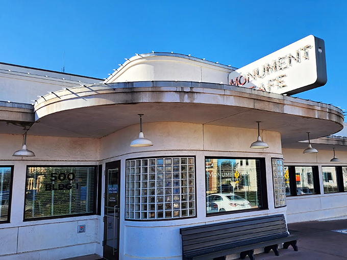 This retro diner exterior whispers promises of comfort food that'll make your grandmother jealous.