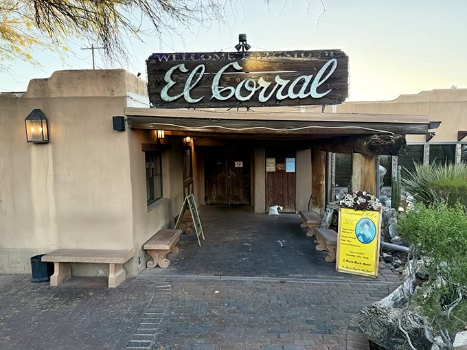 The adobe entrance to El Corral isn't just a doorway—it's a time portal to the days when beef was king and cacti were the only witnesses.