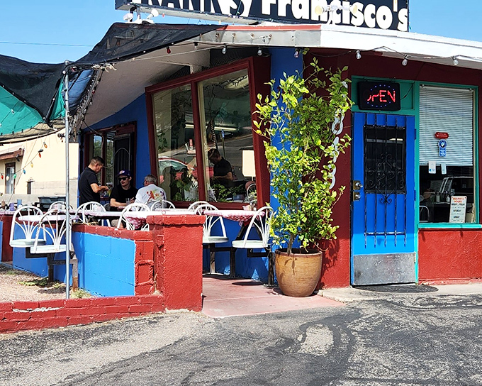 Frank's vibrant exterior is like a desert mirage, except this oasis delivers actual sustenance instead of hallucinations. The blue door beckons hungry travelers.