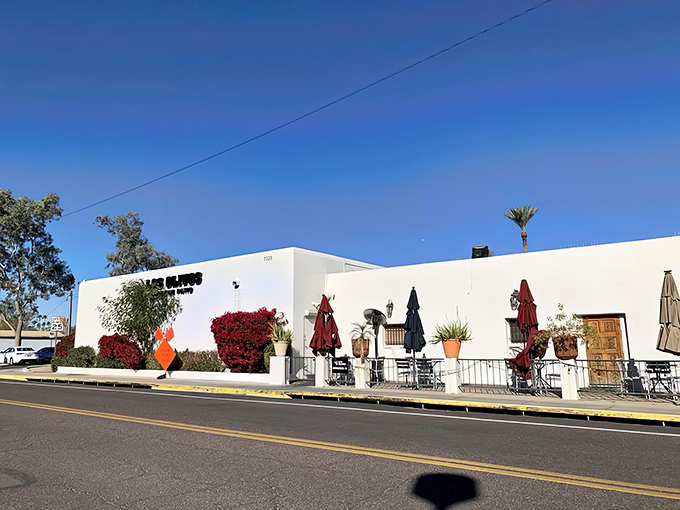 The pristine white walls of Los Olivos stand like a desert mirage, promising culinary treasures within. The vibrant bougainvillea adds that perfect pop of color.