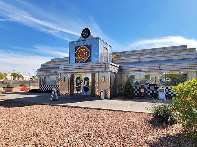 The gleaming chrome exterior of Nana Dee's stands like a time portal to the 1950s, complete with that iconic clock announcing it's always mealtime inside.
