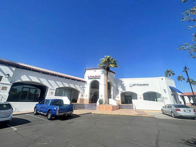 The classic white stucco, red-trimmed arches, and terracotta roof announce without fanfare: "Authentic Mexican food happens here." No neon needed.