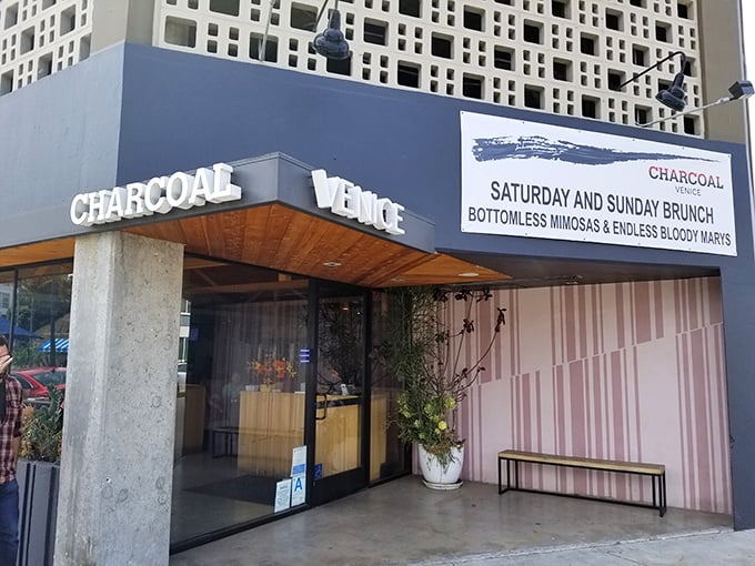 The blue facade of Charcoal Venice promises what lies within&mdash;a temple to flame-kissed cuisine and those legendary bottomless mimosas for weekend warriors.