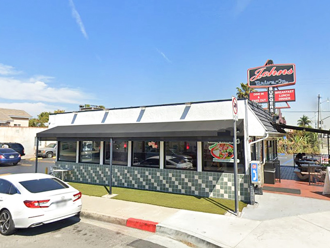 The classic green-tiled exterior of John's Drive-In stands like a time capsule of California burger history, beckoning hungry travelers from miles around.