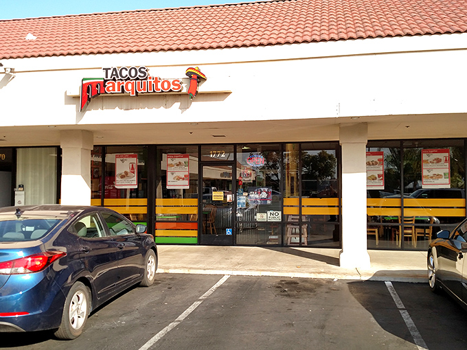 The unassuming storefront might fool you, but those colorful stripes are like runway lights guiding hungry pilots to flavor paradise.