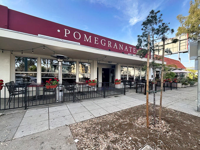 The burgundy awning of Pomegranate stands like a culinary embassy on El Cajon Boulevard, promising Georgian delights within its unassuming storefront.