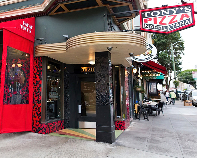 The iconic red and black exterior of Tony's Pizza Napoletana stands as a beacon for pizza pilgrims in San Francisco's North Beach neighborhood.