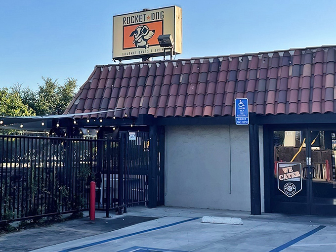 That orange and black sign isn't subtle, but neither is the flavor explosion waiting inside this Fresno favorite.