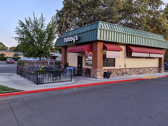 The unassuming green-roofed kingdom of burger bliss. Nobby's exterior might not scream "food destination," but locals know better than to judge this book by its cover.