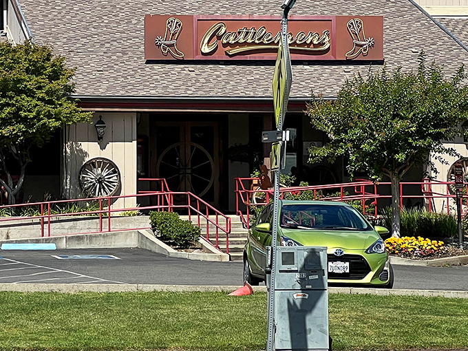 The iconic Cattlemens exterior beckons hungry travelers with its Western charm and cowboy boot signage&mdash;a beacon of beef in Redding's landscape.