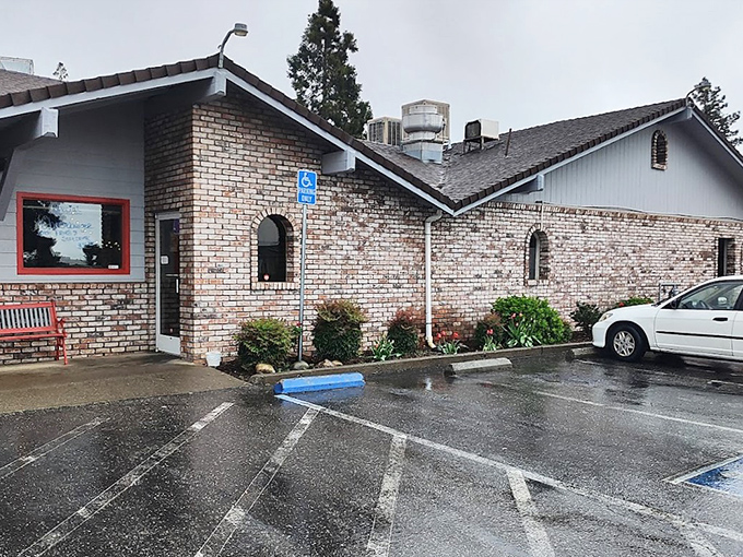 The stone facade and classic neon sign promise what every road trip deserves&mdash;a genuine diner experience where comfort trumps pretension.