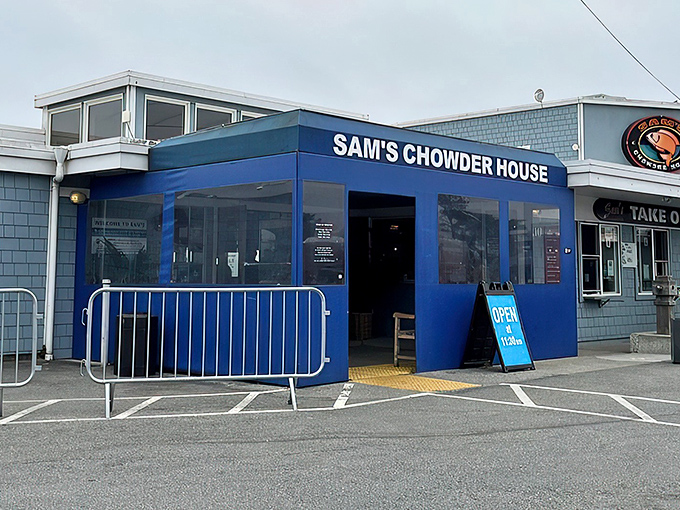 The iconic blue exterior of Sam's Chowder House stands like a beacon of seafood salvation on the Half Moon Bay coastline.