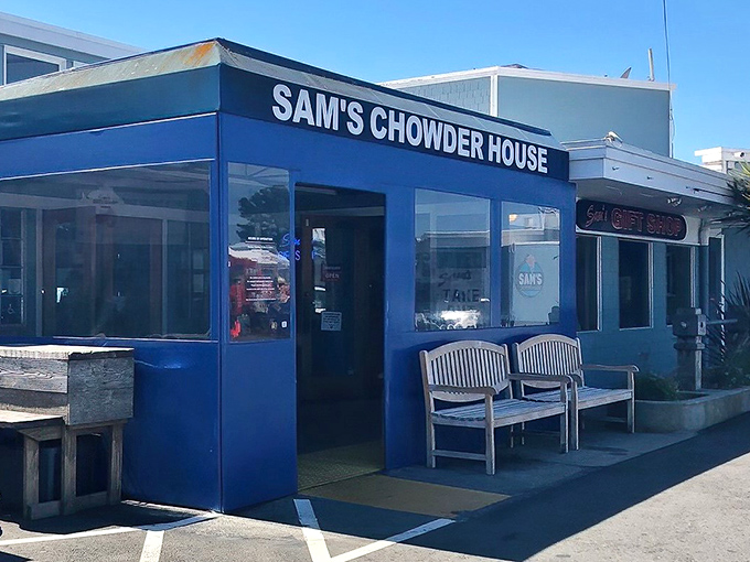 The iconic blue exterior of Sam's Chowder House glows at dusk, a beacon for seafood lovers along the Half Moon Bay coastline.