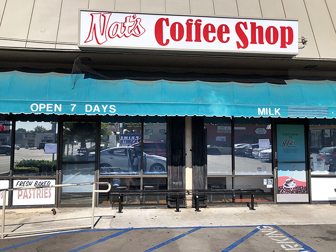 The unassuming storefront of Nat's Coffee Shop beckons with its retro charm and teal awning—proof that culinary treasures often hide in plain sight.