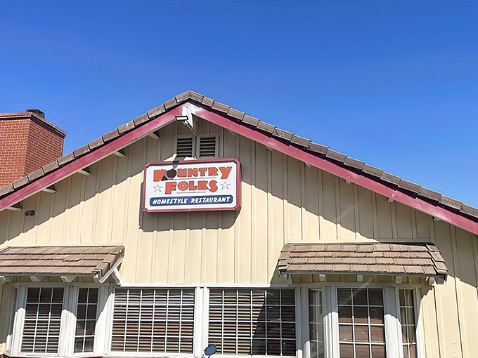 The charming cream-colored exterior with distinctive red trim promises homestyle comfort without pretension. A roadside beacon for breakfast lovers.