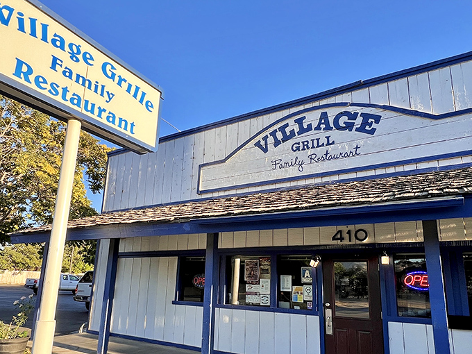 The classic blue and white exterior of Village Grill stands as a beacon of comfort food in Tehachapi, promising homestyle cooking that transcends trends.