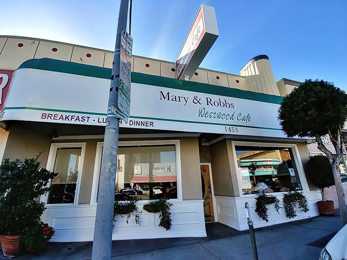 The classic green-trimmed exterior of Mary and Robb's Westwood Cafe stands as a beacon of comfort food in a sea of trendy LA eateries.
