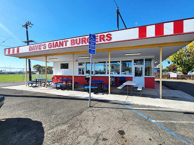 The red and white striped awning isn't just decoration&mdash;it's a beacon for burger lovers. Dave's Giant Hamburgers stands proudly in Fairfield, promising satisfaction without pretension.