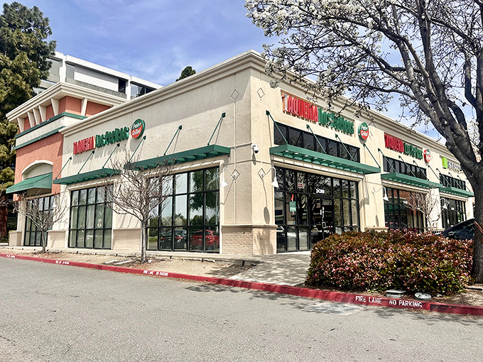 Los Pericos stands proudly in its strip mall kingdom, where the green awnings and bold signage promise culinary treasures within. No Michelin stars needed when the parking lot is this full.