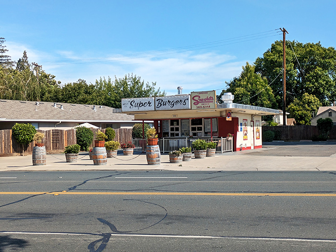 The classic red and white fa&ccedil;ade of Snow White Drive-In stands like a time capsule in Lodi, beckoning hungry travelers with its "Super Burgers" promise.