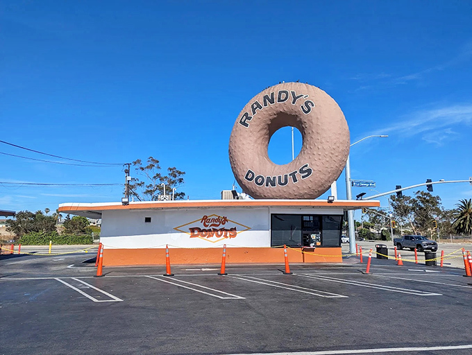 The most famous donut in America stands sentinel over Inglewood, a 32-foot testament to our collective sweet tooth and architectural whimsy.