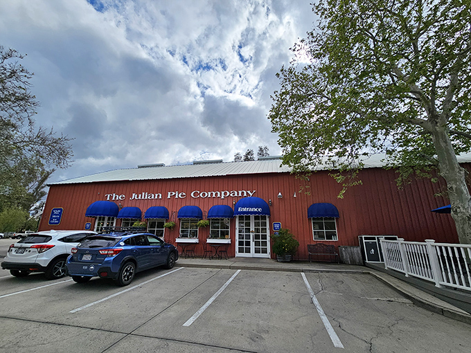 The iconic red exterior with bright blue awnings beckons pie lovers like a beacon of hope in a world of mediocre desserts.