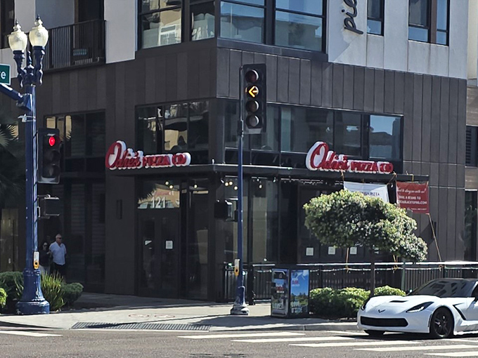 Modern meets mouthwatering at Odie's corner location in Oceanside, where that bold red signage practically screams "pizza paradise awaits inside!"