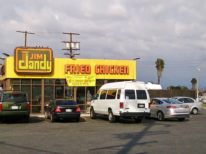 The iconic yellow facade and retro signage of Jim Dandy stands as a beacon of fried chicken perfection in South Los Angeles.