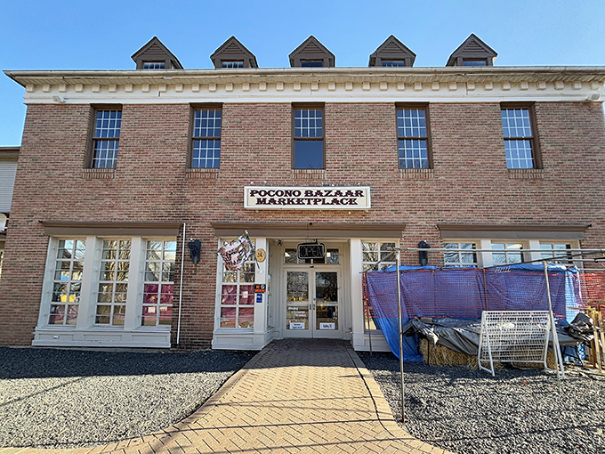 The brick facade of Pocono Bazaar welcomes treasure hunters with dormered windows and the promise of discoveries waiting just beyond those doors.