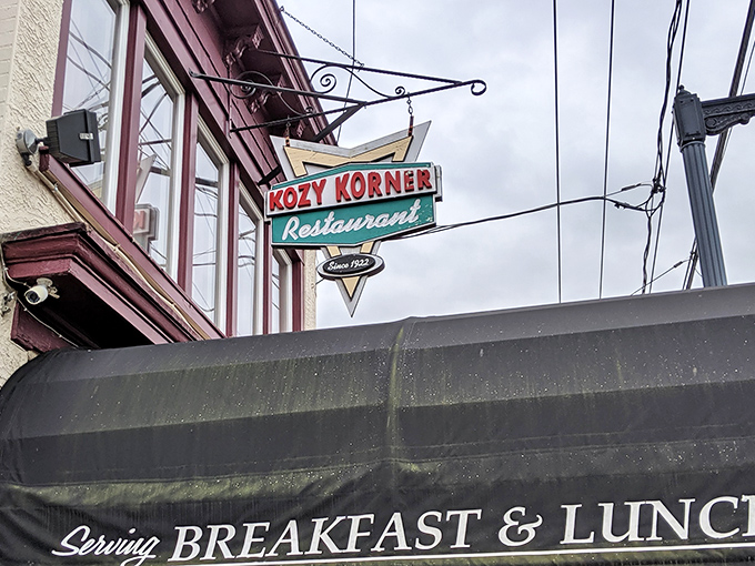 That vintage neon sign hanging above Kozy Korner isn't just advertising &ndash; it's a time portal to when diners were the social media of their day.