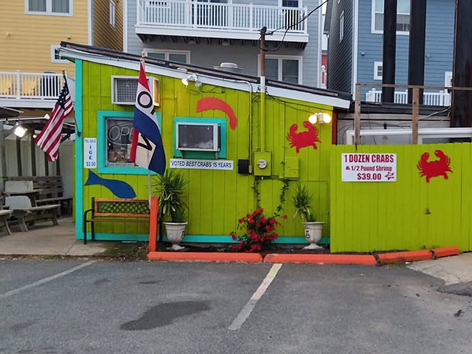 The lime-green exterior of Bahama's Crabshack stands out like a tropical oasis on Fenwick Island, beckoning seafood lovers with its unmistakable charm and vibrant personality.