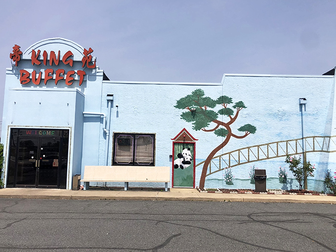 The blue exterior with its bold red signage promises abundance within, like a culinary oasis in Dover's landscape.