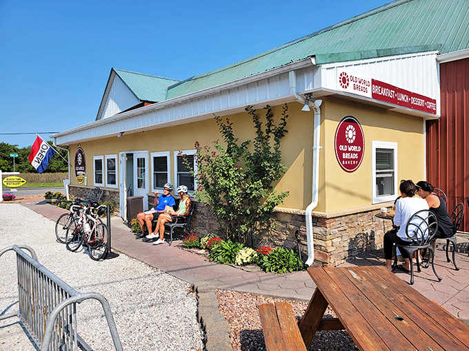 The cheerful yellow exterior of Old World Breads beckons like a carb-lover's lighthouse on Nassau Road, complete with outdoor seating for immediate gratification.