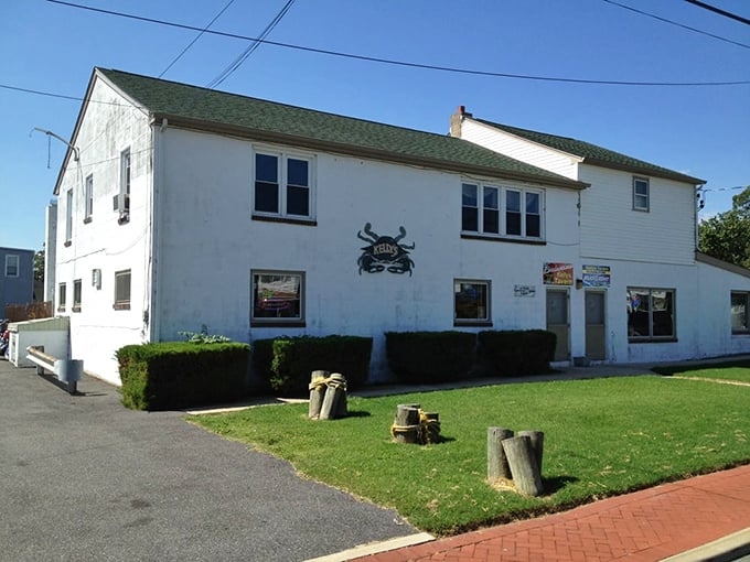 The unassuming exterior of Kelly's Tavern stands like a seafood speakeasy in Port Penn&mdash;proof that culinary treasures often hide in plain sight.