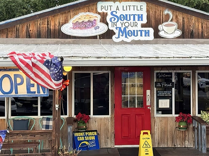 The promise of Southern comfort beckons from this rustic wooden facade. That red door isn't just an entrance&mdash;it's a portal to flavor country.