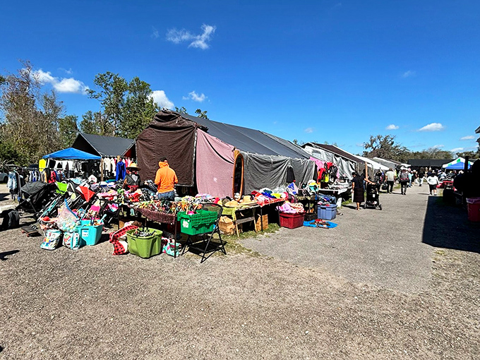 The main thoroughfare at Mi Pueblo buzzes with weekend energy as shoppers hunt for treasures under Florida's brilliant blue skies.