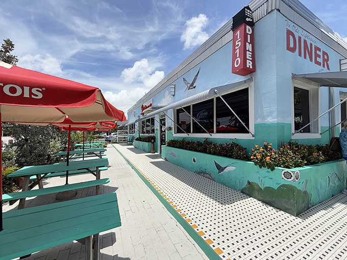 That turquoise exterior isn't just pretty &ndash; it's practically broadcasting "amazing comfort food lives here, folks!"